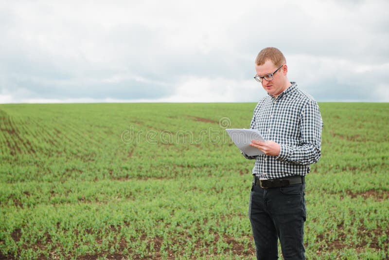 Happy Farmer in the Fields with a Laptop Computer Stock Image - Image ...