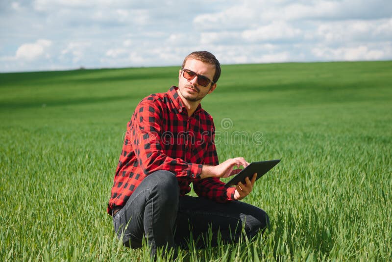 Happy Farmer in the Fields with a Laptop Computer Stock Photo - Image ...