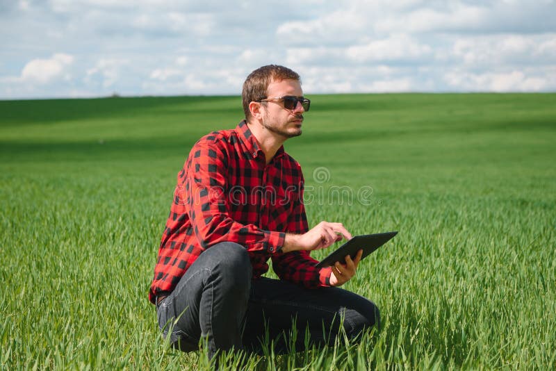 Happy Farmer in the Fields with a Laptop Computer Stock Photo - Image ...