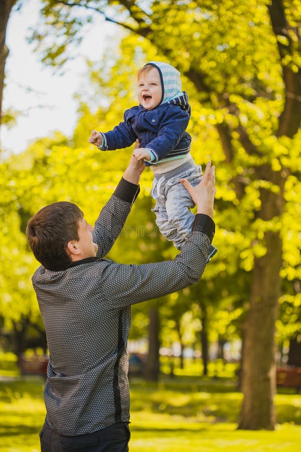 Happy Father and Baby are Playing in the Park Stock Image - Image of ...