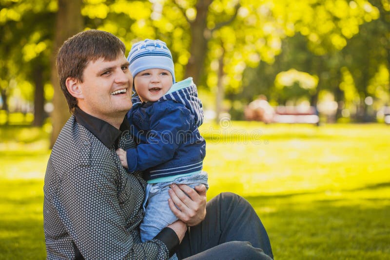 Happy Father and Baby are Playing in the Park Stock Photo - Image of ...