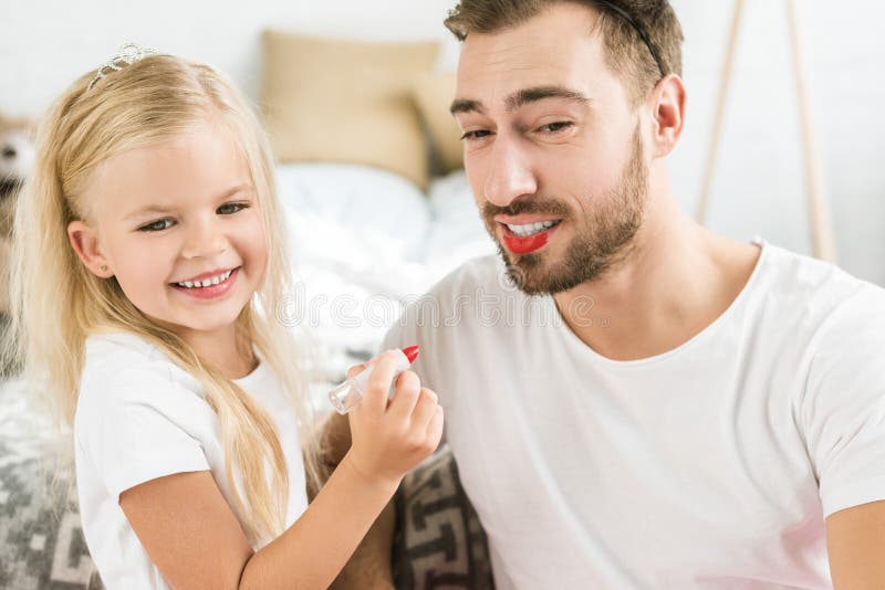 Happy Father and Cute Little Daughter Playing and Applying Makeup Stock ...