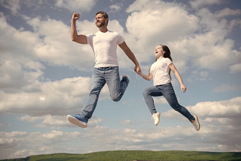Happy Father and Daughter Jump in Sky. Friendship Stock Image - Image ...