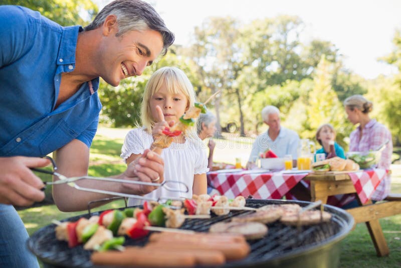 Happy Father Doing Barbecue with Her Daughter Stock Image - Image of ...