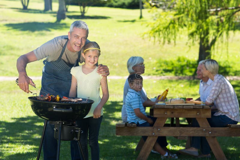 Happy Father Doing Barbecue with His Daughter Stock Image - Image of ...