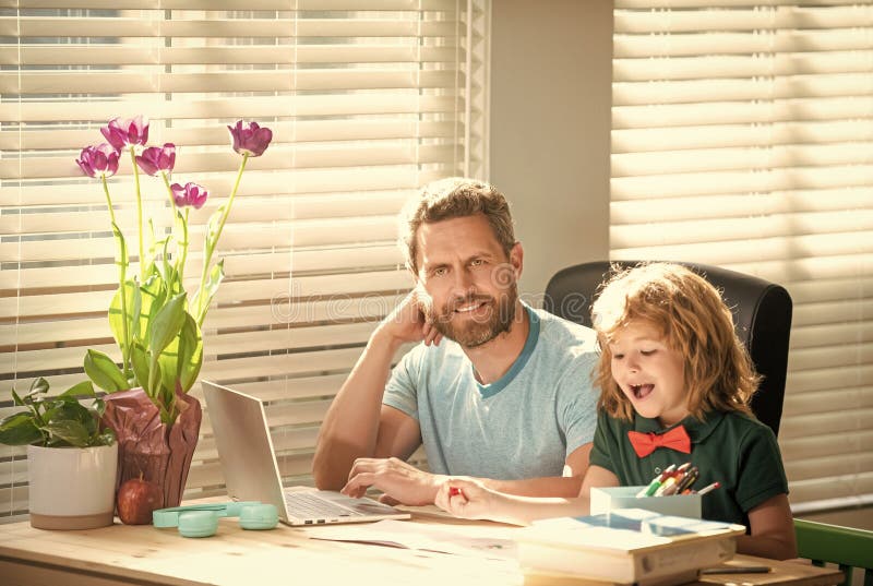 Happy Father Helping His School Son Study with Writing and Laptop ...
