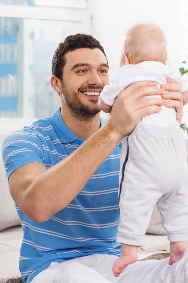 Happy Father Lies With A Baby Stock Photo - Image of father, parent ...
