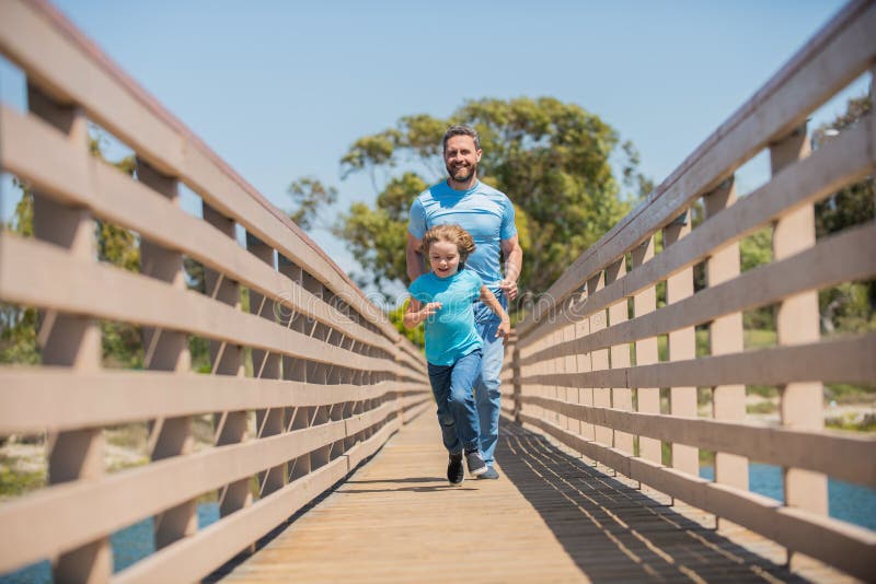 Happy Father Running with His Son Outside, Fun Stock Image - Image of ...