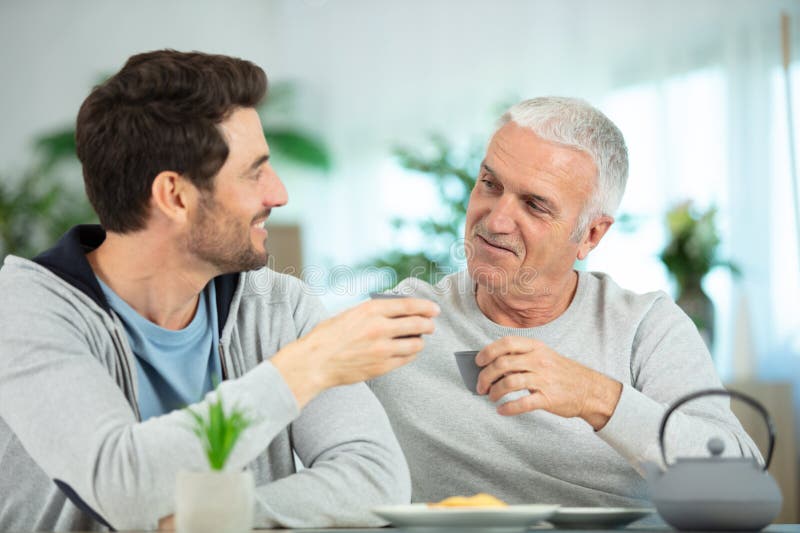 Happy Father and Son Communicating while Having Tea Stock Image - Image ...