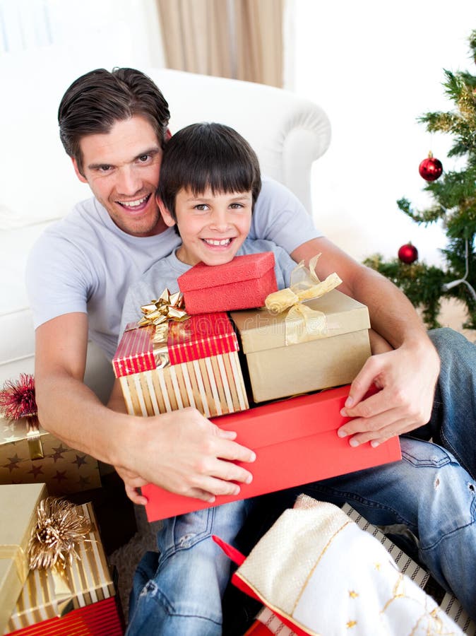 Happy Father and Son Holding Christmas Presents Stock Photo - Image of ...
