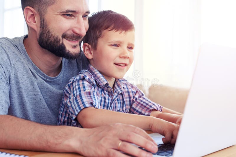Happy Father with Son Playing Computer Games on Laptop Stock Image ...