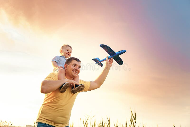 Happy Father with Son Playing with Toy Plane. Dream To Be a Pilot Stock ...