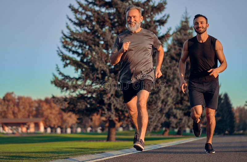 The Happy Father and Son Running on the Road. Stock Photo - Image of ...