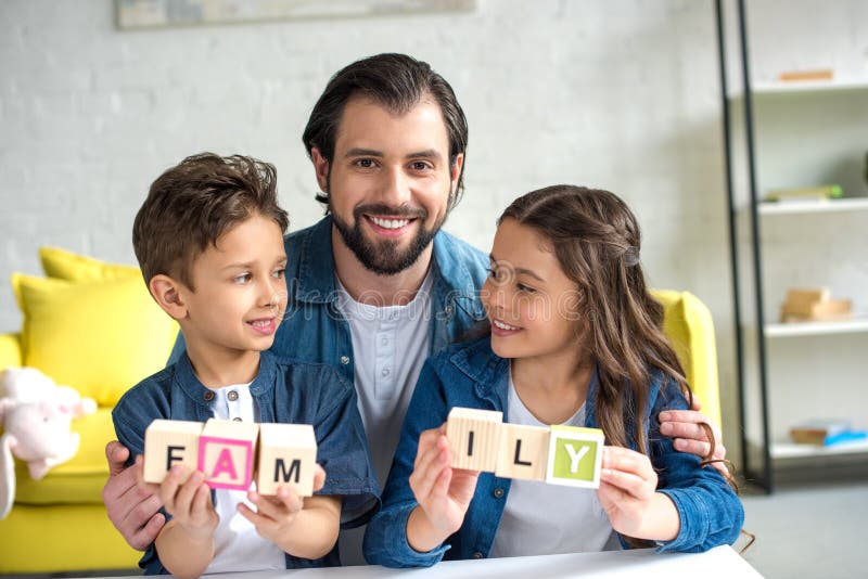 Happy Father with Two Adorable Kids Holding Cubes Stock Image - Image ... Happy Father with Two Adorable Kids Holding Cubes Stock Image - Image ...