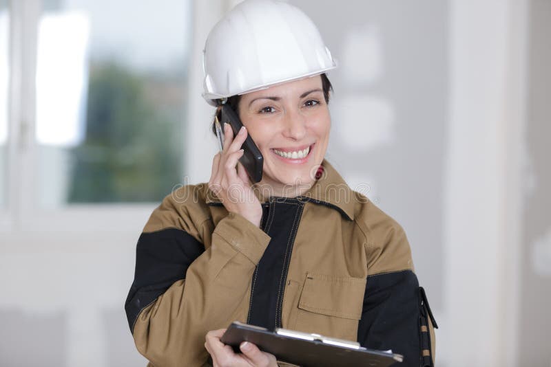 Happy Female Builder Talking on Phone Stock Image - Image of outdoors ...