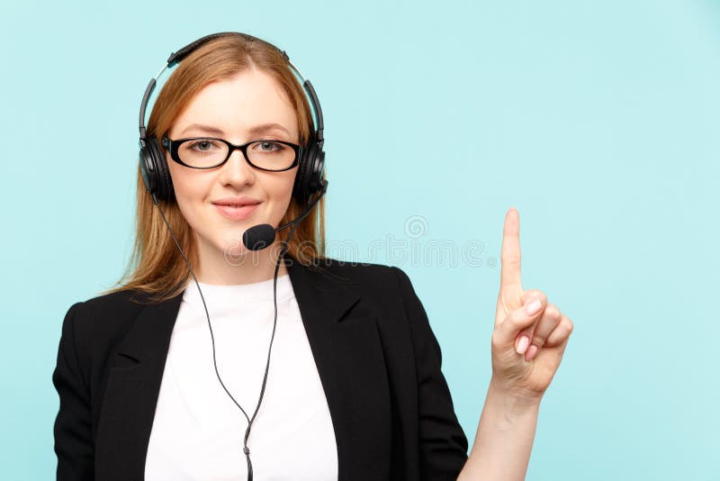 Happy Female Call Center Operator in the Blue Studio Pointing Something ...