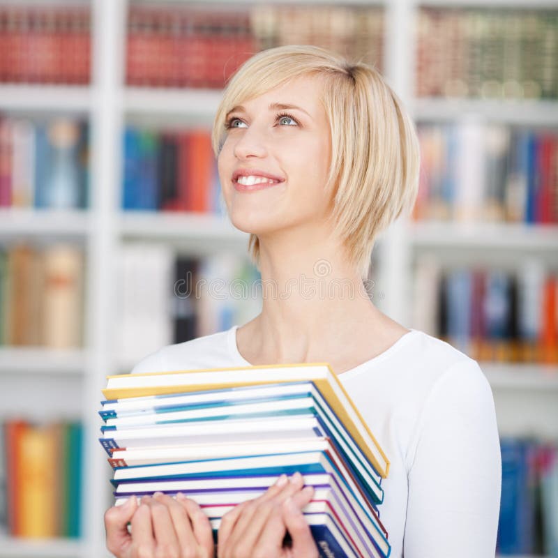 Happy Female Carrying Books in Library Stock Image - Image of ...