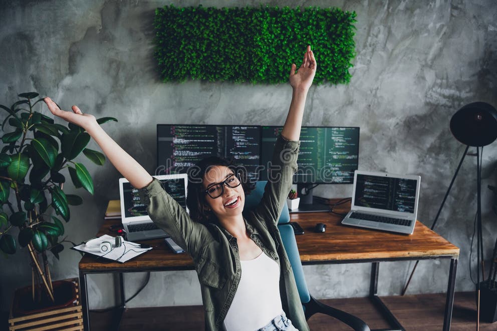 Young Woman Programmer Celebrates Success while Working in a Creative ...