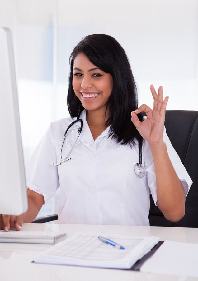 Happy Female Doctor Gesturing Ok Sign Stock Image - Image of natural ...