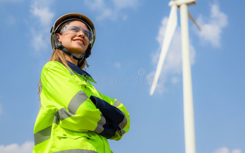 Happy Female Engineer Technician Working Outdoor at Wind Turbine Field ...