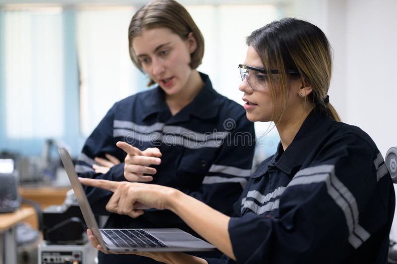 Happy Female Engineers Team Using Laptop Checking and Operating Stock ...