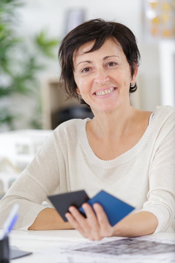 Happy Female Interior Designer at Desk Stock Image - Image of colors ...