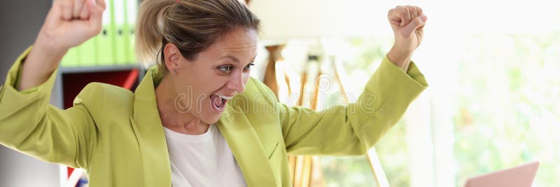 Happy Female Manager Looking at Computer Screen while Sitting at Desk ...