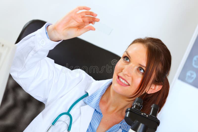 Happy Female Medical Doctor Working with Sample Stock Image - Image of ...
