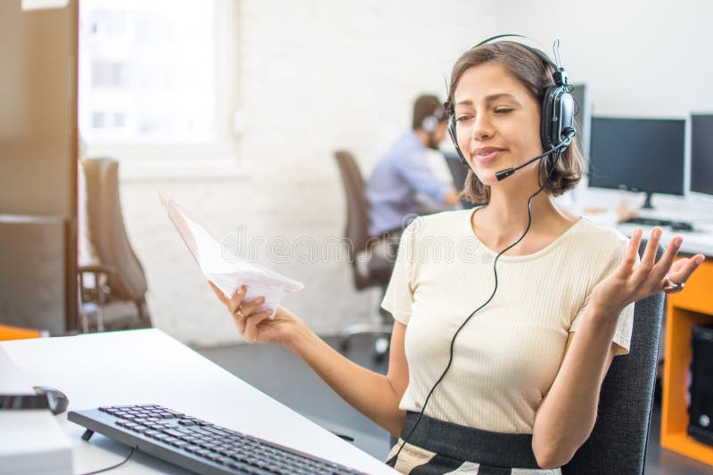 Happy Female Operator in Headset Talking with Client at Call Center ...