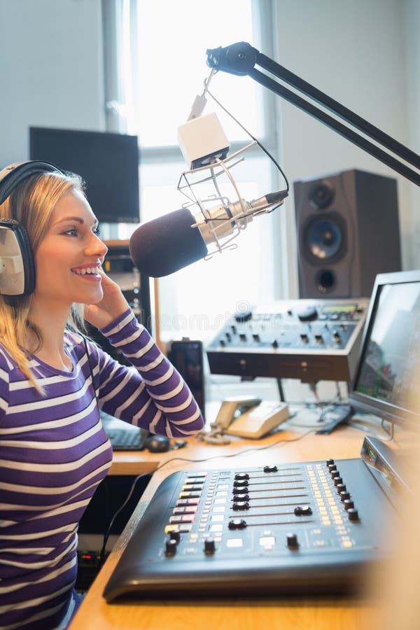Happy Female Radio Host Broadcasting through Microphone Stock Photo ...