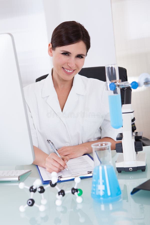 Female Scientist Writing on Paper Stock Image - Image of medical ...