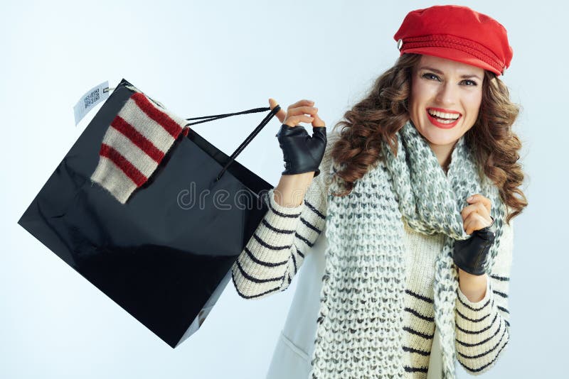 Happy Female Showing Black Shopping Bag With Purchased Sweater Stock