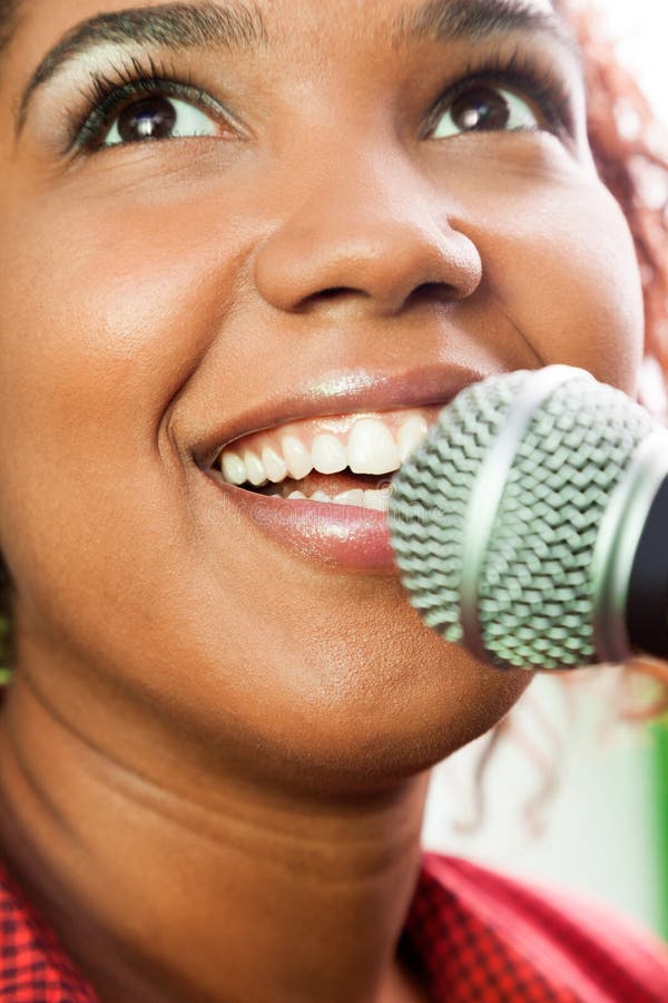 Happy Female Singer Looking Up while Performing Stock Image - Image of ...
