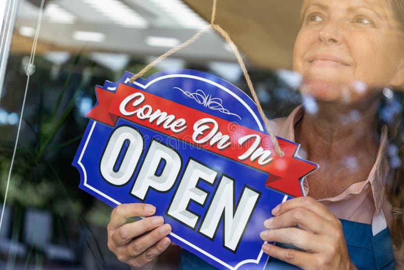 Happy Female Store Owner Turning Open Sign in Window Stock Image ...