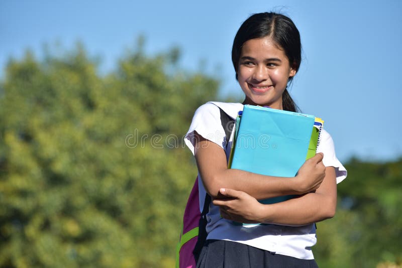 A Happy Female Student Holding Books Stock Photo - Image of college ...