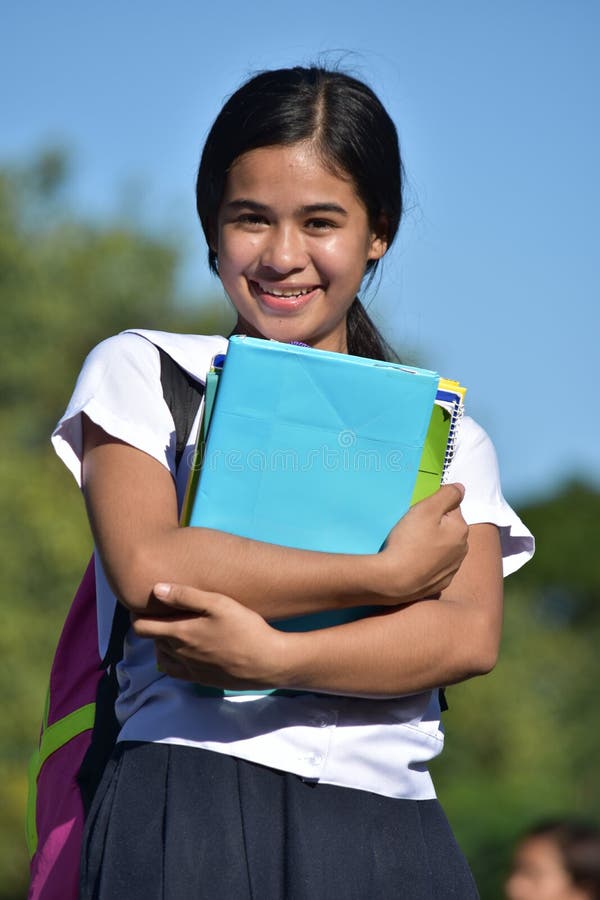 A Happy Female Student Holding Books Stock Photo - Image of pupils ...