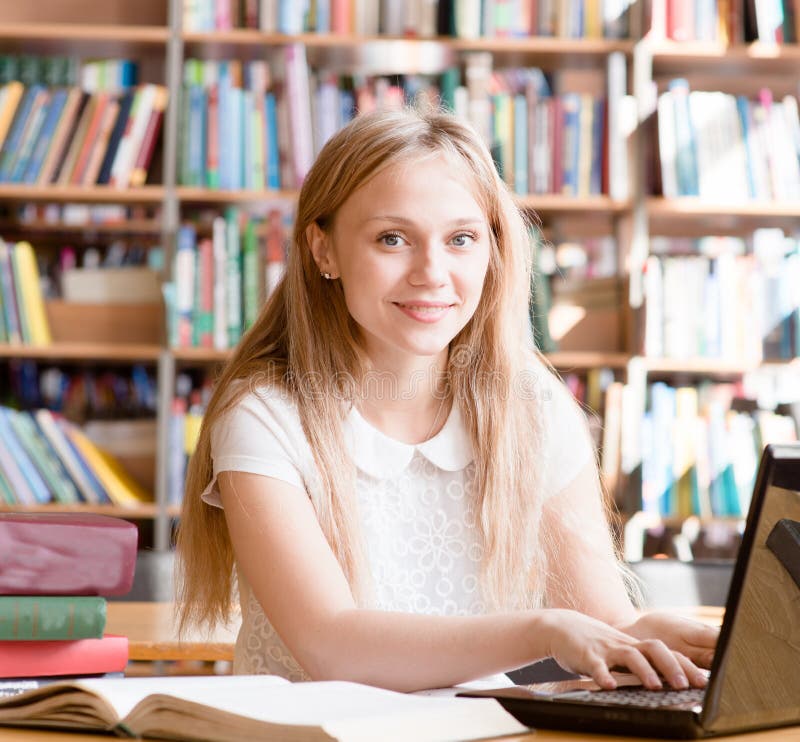 Happy Female Student with Laptop in Library Stock Image - Image of ...