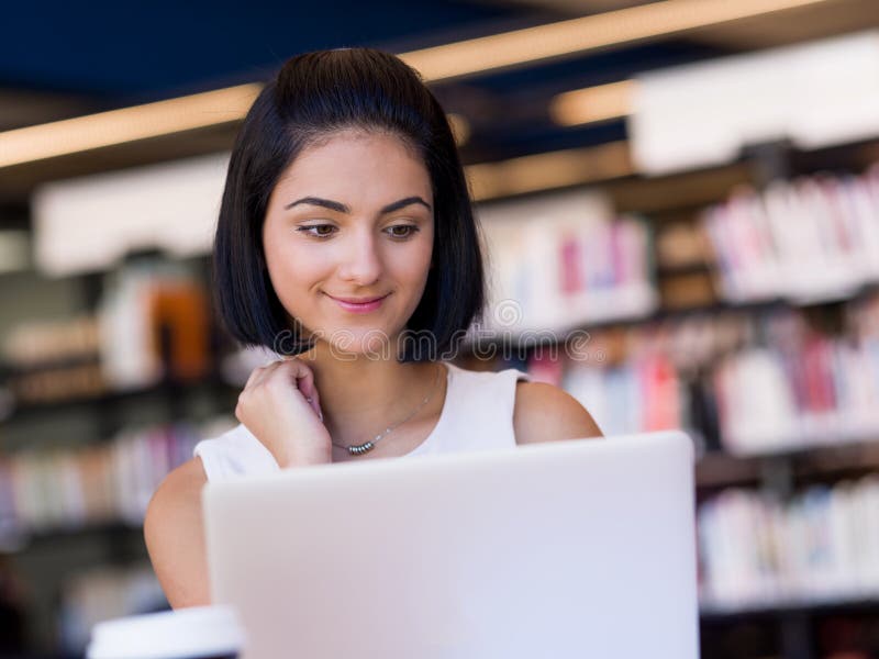 Happy Female Student at the Library Stock Image - Image of adult ...