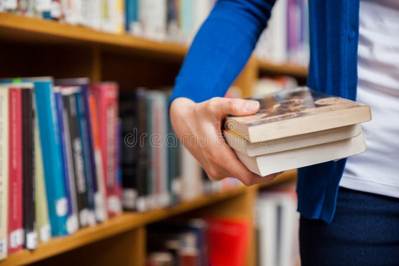 Happy Female Student Taking Books in the Library Stock Photo - Image of ...