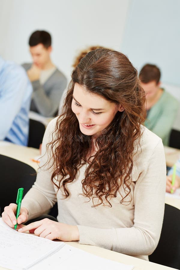 Student Taking Notes in Class Stock Photo - Image of student, school ...