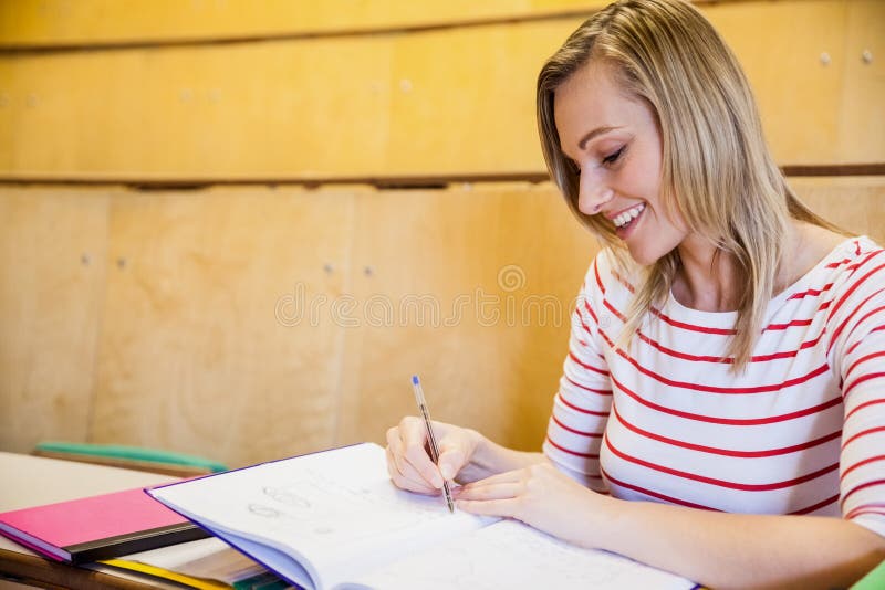 Happy Female Student Writing Notes Stock Photo - Image of assignment ...