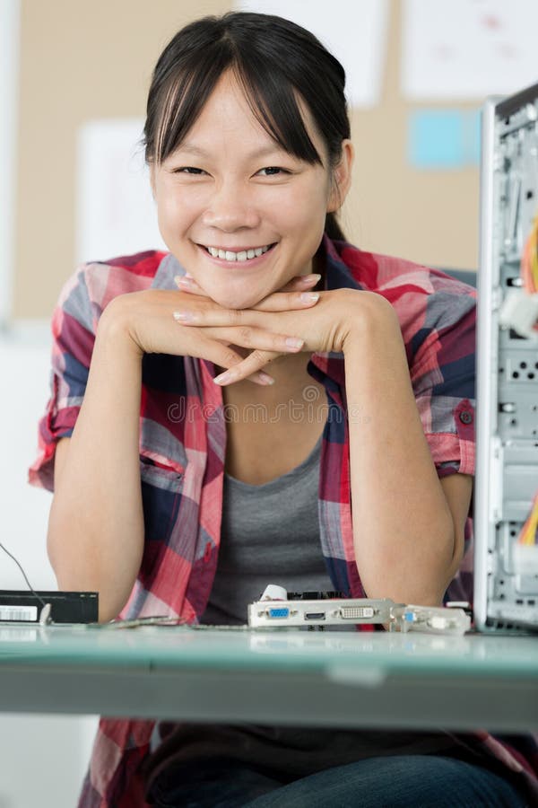 Happy Female Technician Fixing Computer Stock Photo - Image of room ...