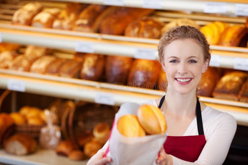 Happy Female Worker Giving Bag of Breads Stock Image - Image of person ...