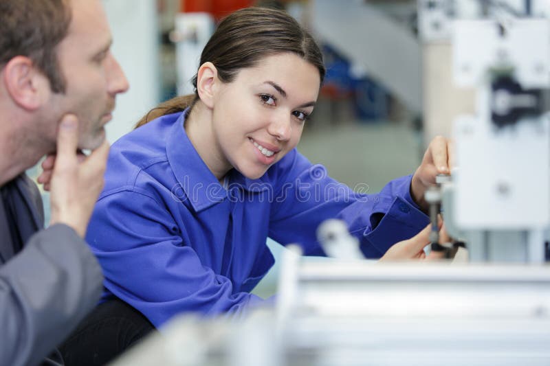 Happy Female Worker in Metal Workshop Stock Photo - Image of ...