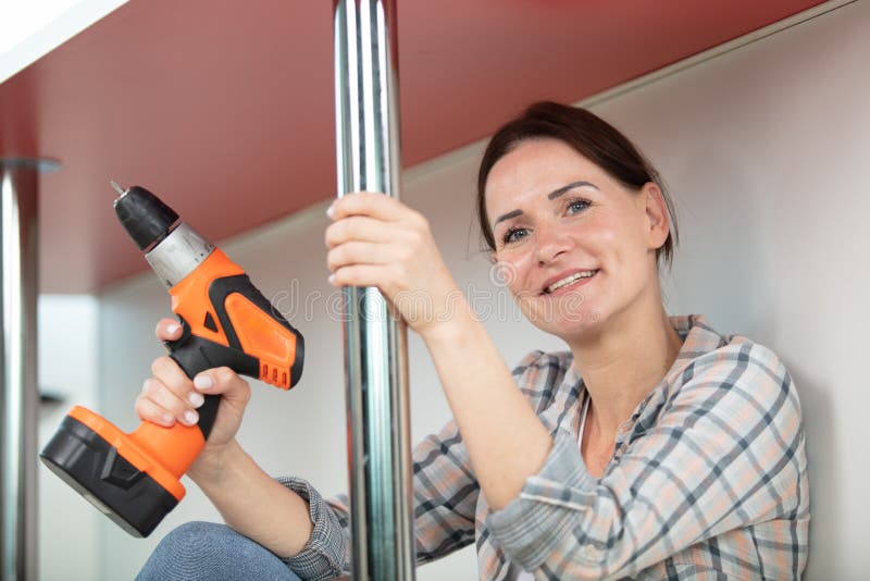 Happy Female Worker Under Table Stock Image - Image of home, piece ...