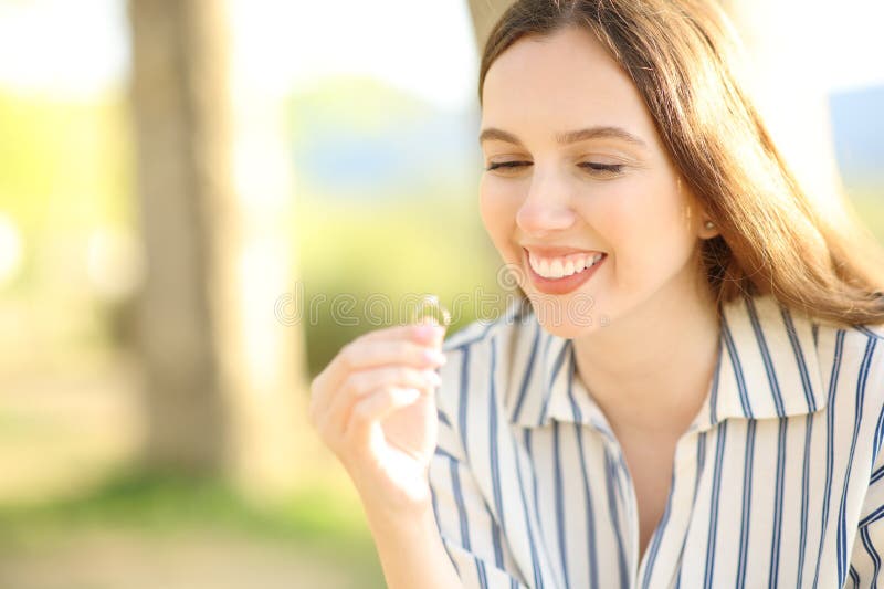 Happy Fiancee Looking at Engagement Ring Stock Photo - Image of ...