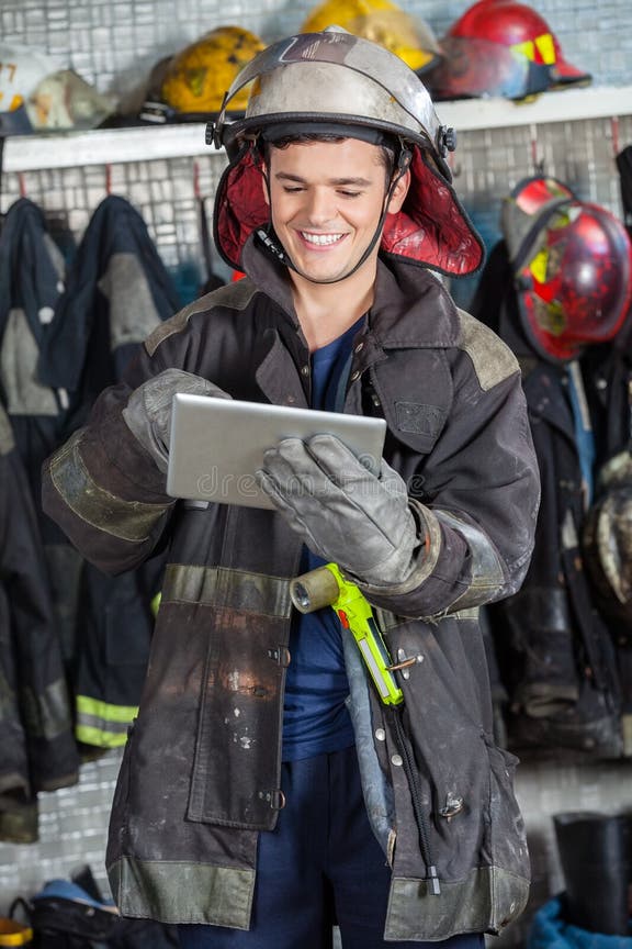 Happy Fireman Using Digital Tablet Stock Image - Image of computer ...