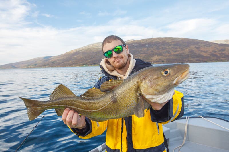 Happy Fisherman with Cod Fish in Hands Stock Photo - Image of hobby ...