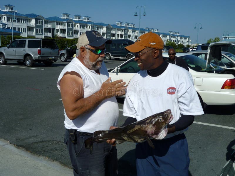Happy Fishermen with Cod editorial stock image. Image of american ...