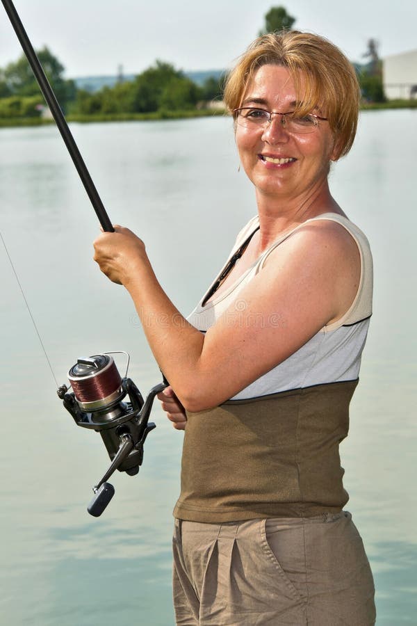 Happy Fisherwoman Holding Big Arctic Cod. Norway Happy Fishing. Woman ...